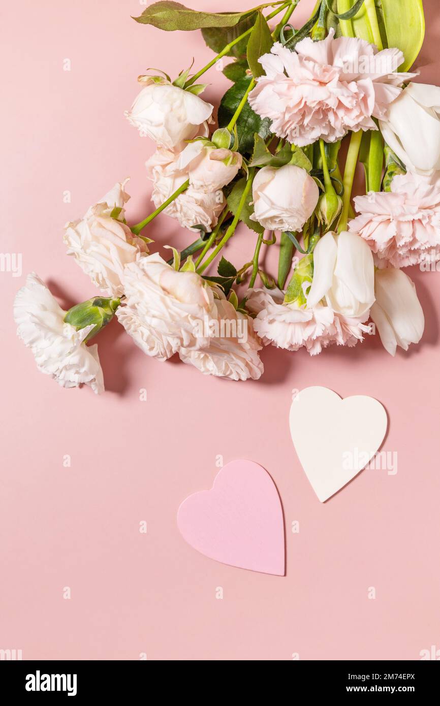 Valentine's Day greeting card with beautiful flowers on pink background ...