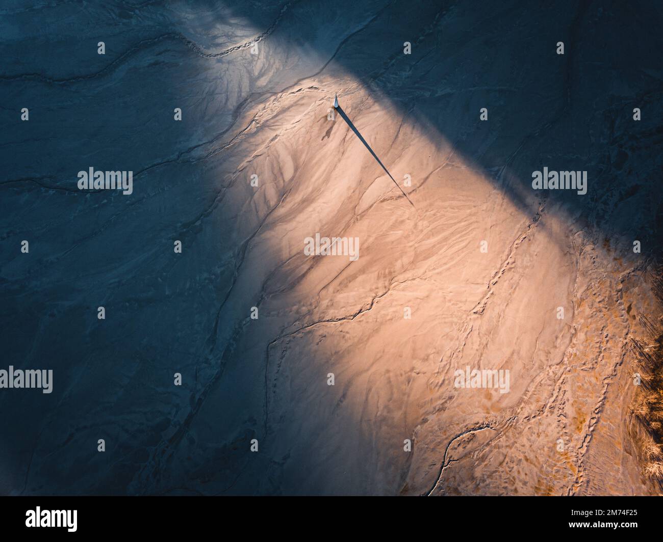 Aerial view of church tower flooded by copper mining residuals in ...