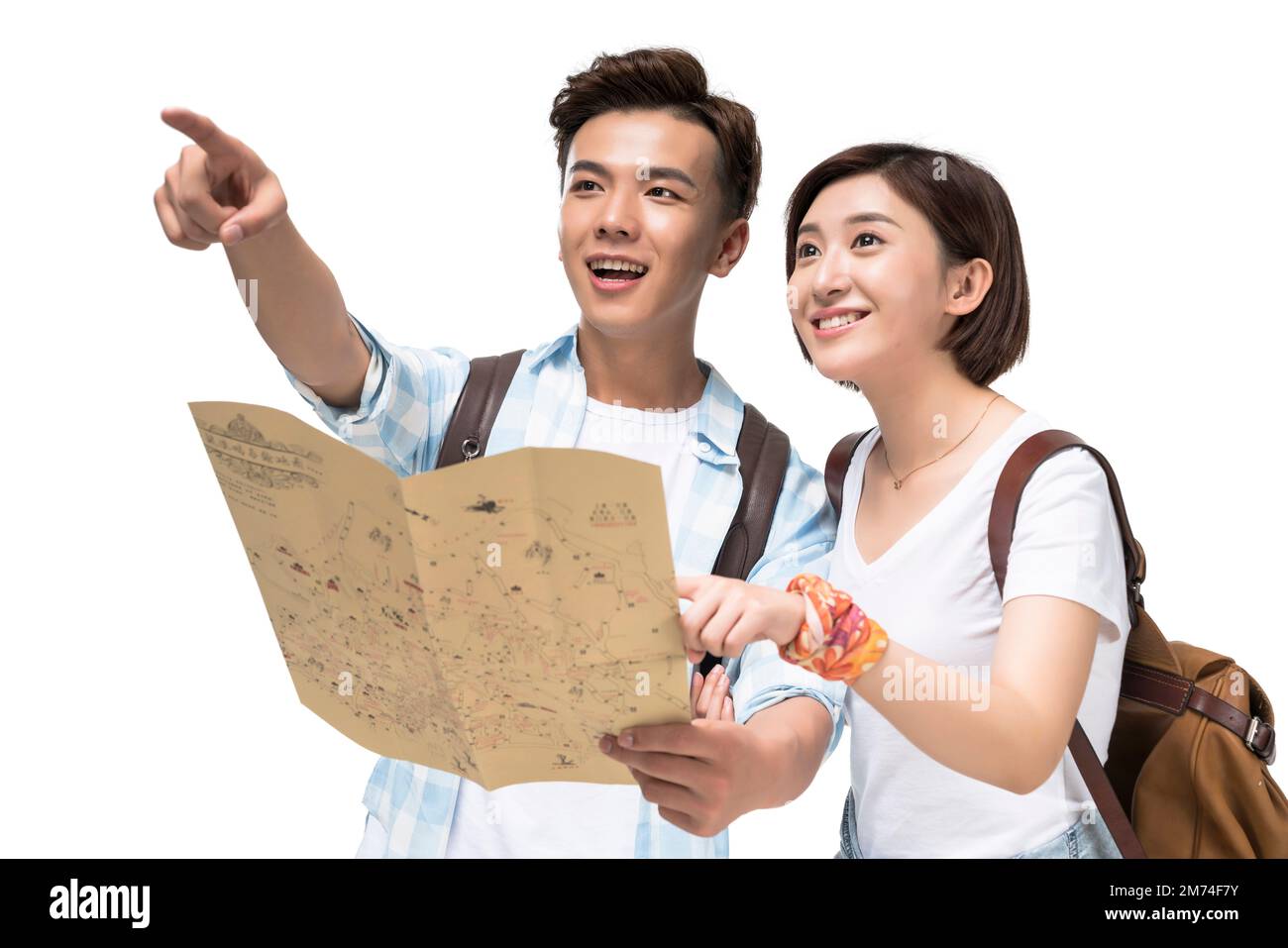 Happy young couple holding a map Stock Photo - Alamy