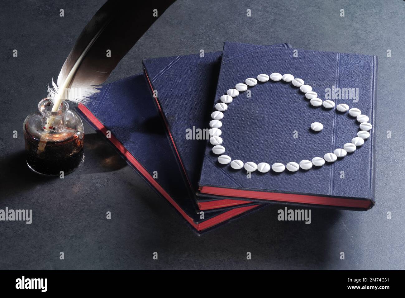 Heart symbol arranged from pills on a book. Law in medicine. Concept of ...