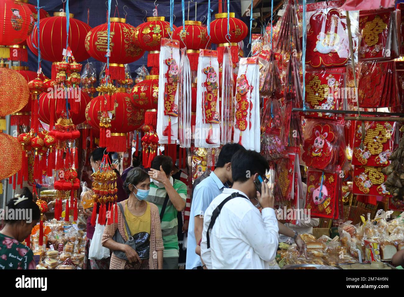 Yangon, Myanmar. 7th Jan, 2023. People shop for decorations for the ...