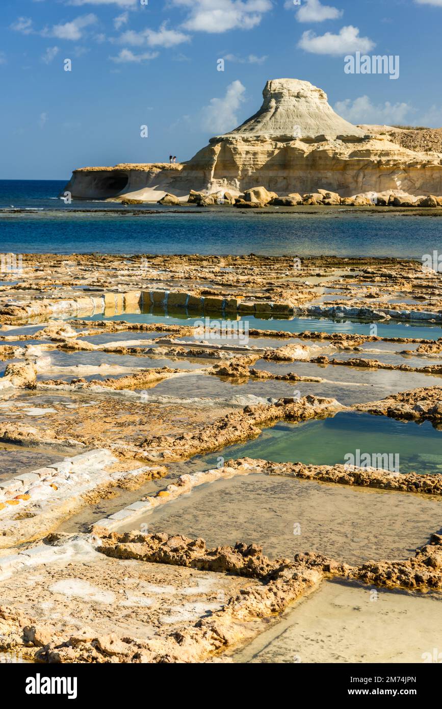 Salt pans in Xwejni Bay beach on the island of Gozo, Malta. Traditional ...