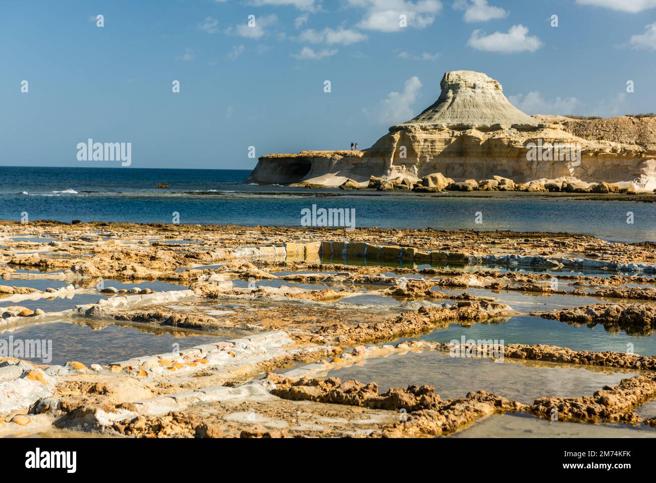 Salt pans in Xwejni Bay beach on the island of Gozo, Malta. Traditional ...