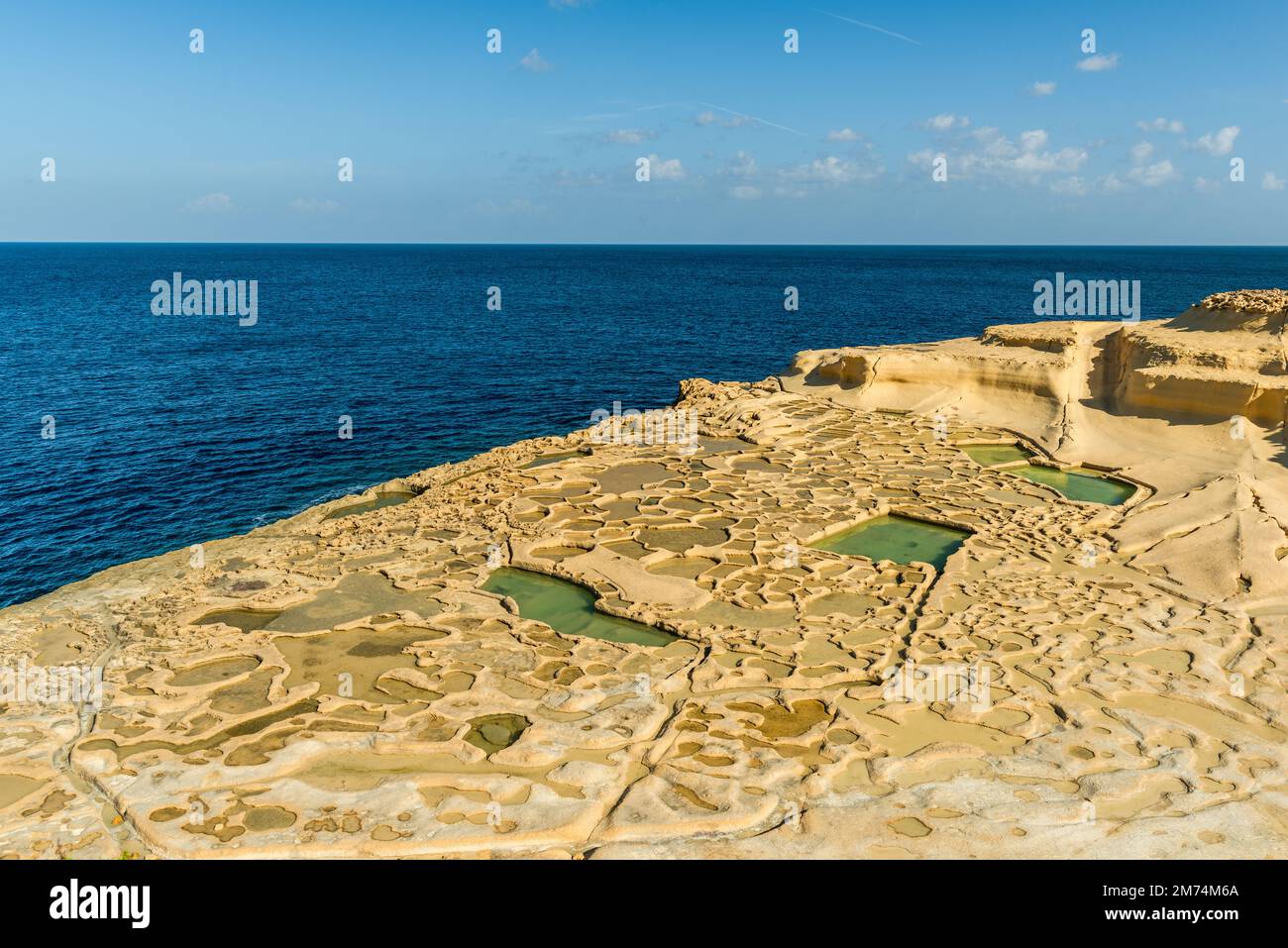 Traditional salt pans in Xwejni Bay on the island of Gozo, Malta Stock ...