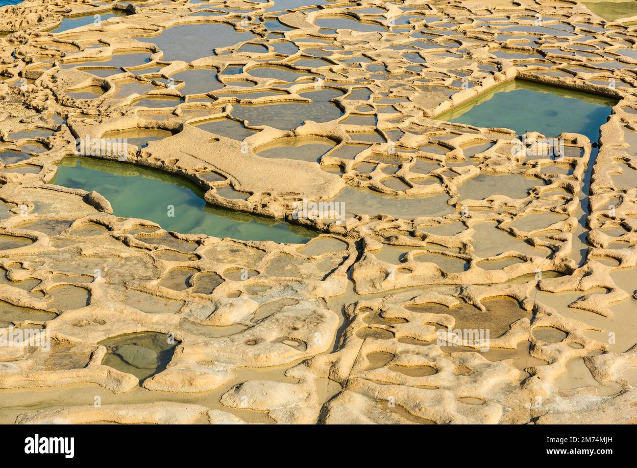Traditional salt pans in Xwejni Bay on the island of Gozo, Malta Stock ...