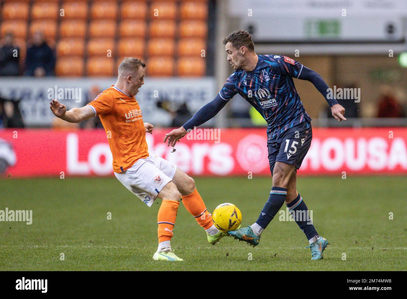 Harry Toffolo #15 of Nottingham Forest is tackled by Shayne Lavery #19 ...