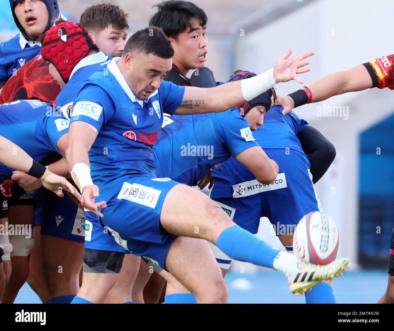January 7, 2023, Kawasaki, Japan - Shizuoka BlueRevs scrum half Bryn Hall kicks the ball during ...
