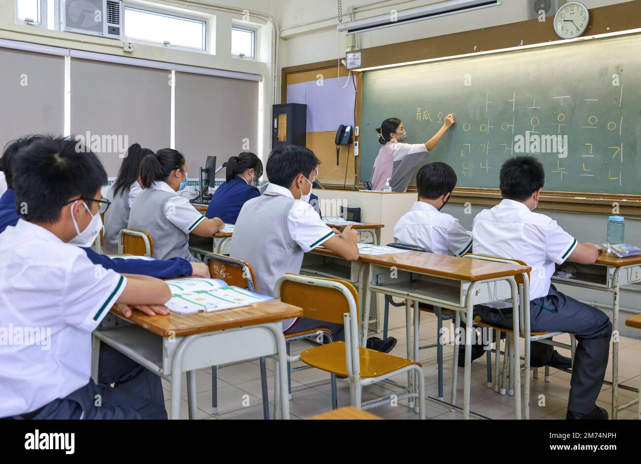 Korean language teacher Lai Yuen-wa teaching Form One class at Mu Kuang ...