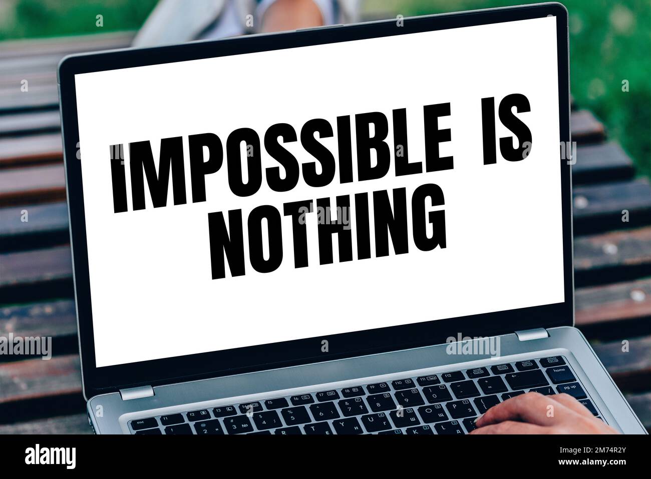 Hand writing sign Impossible Is Nothing. Business approach Something ...