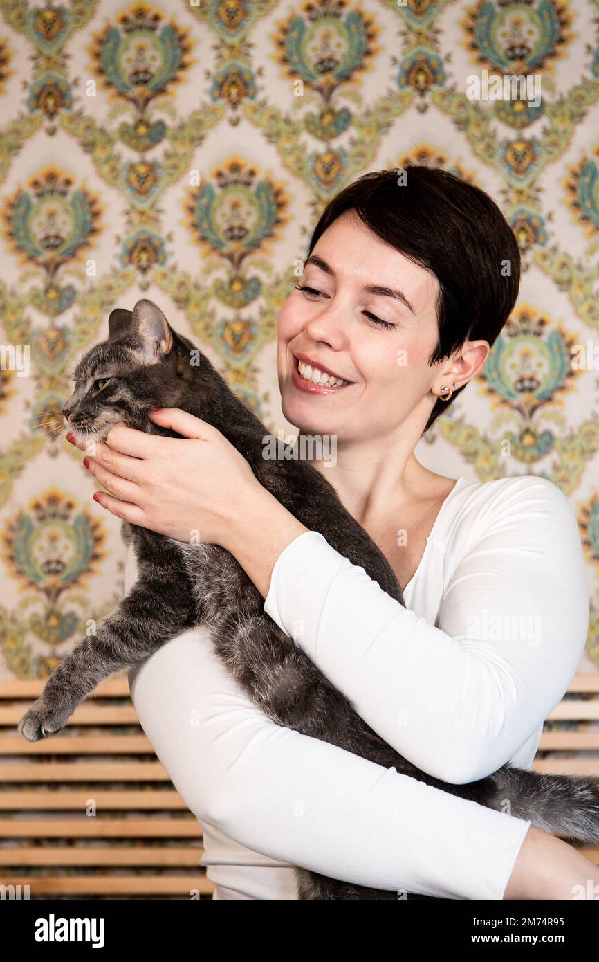 Cat in bed with woman hi-res stock photography and images - Alamy