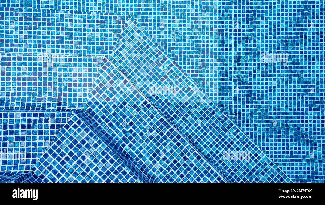 The light reflected on the top of the water surface of the pool lined ...