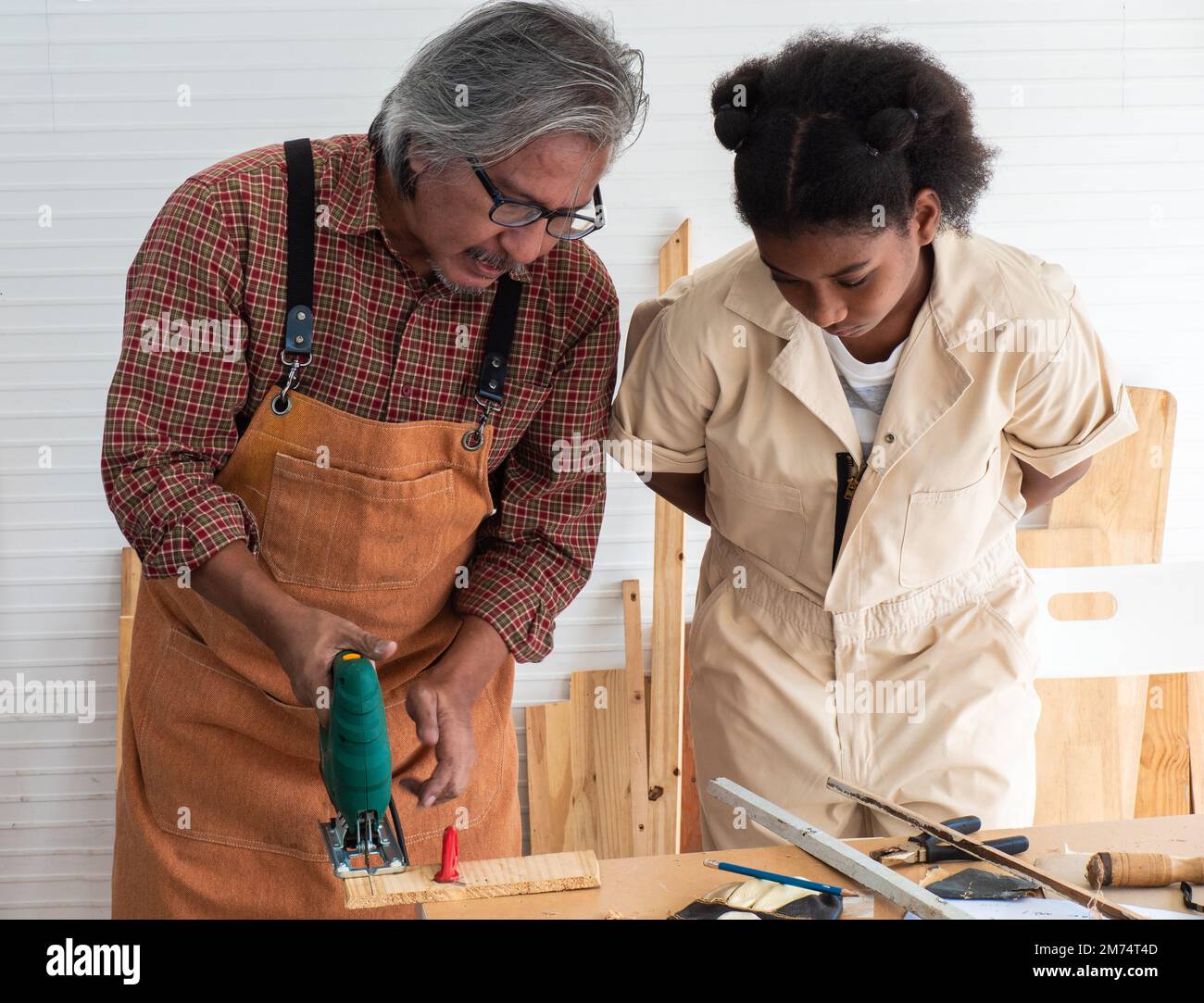 Grandfather teaching woodworking hi-res stock photography and images ...