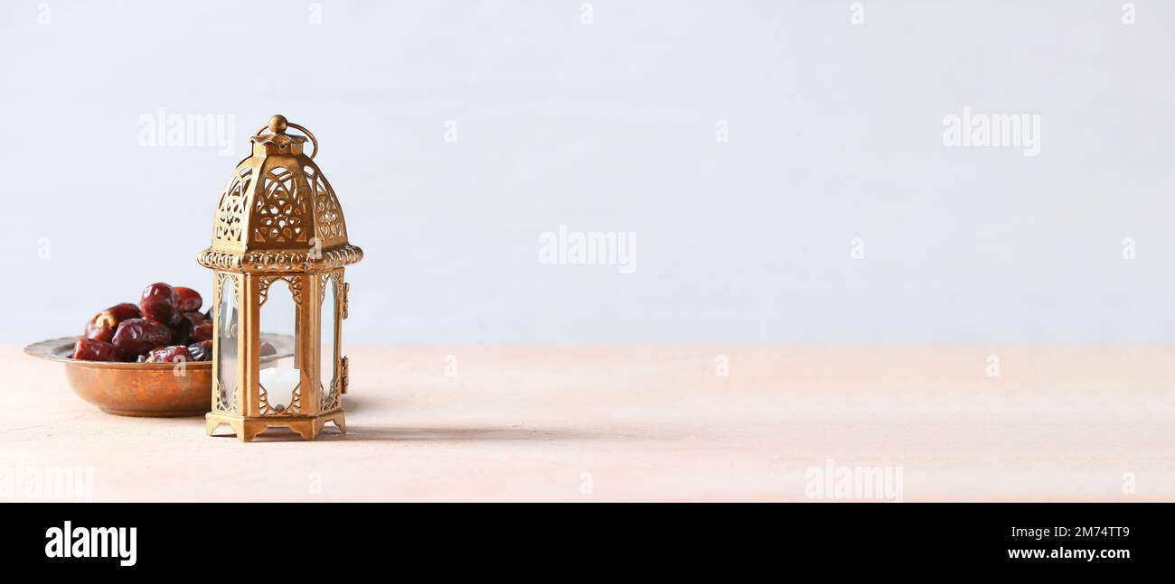 Muslim lamp and dates on light background with space for text Stock ...