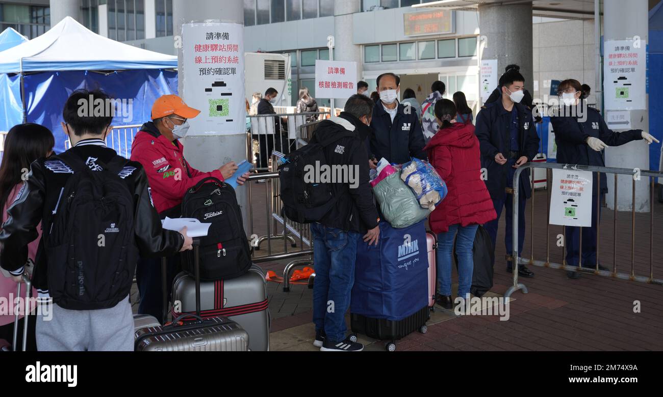 Travellers in Hong Kong wait to cross the border into mainland China ...