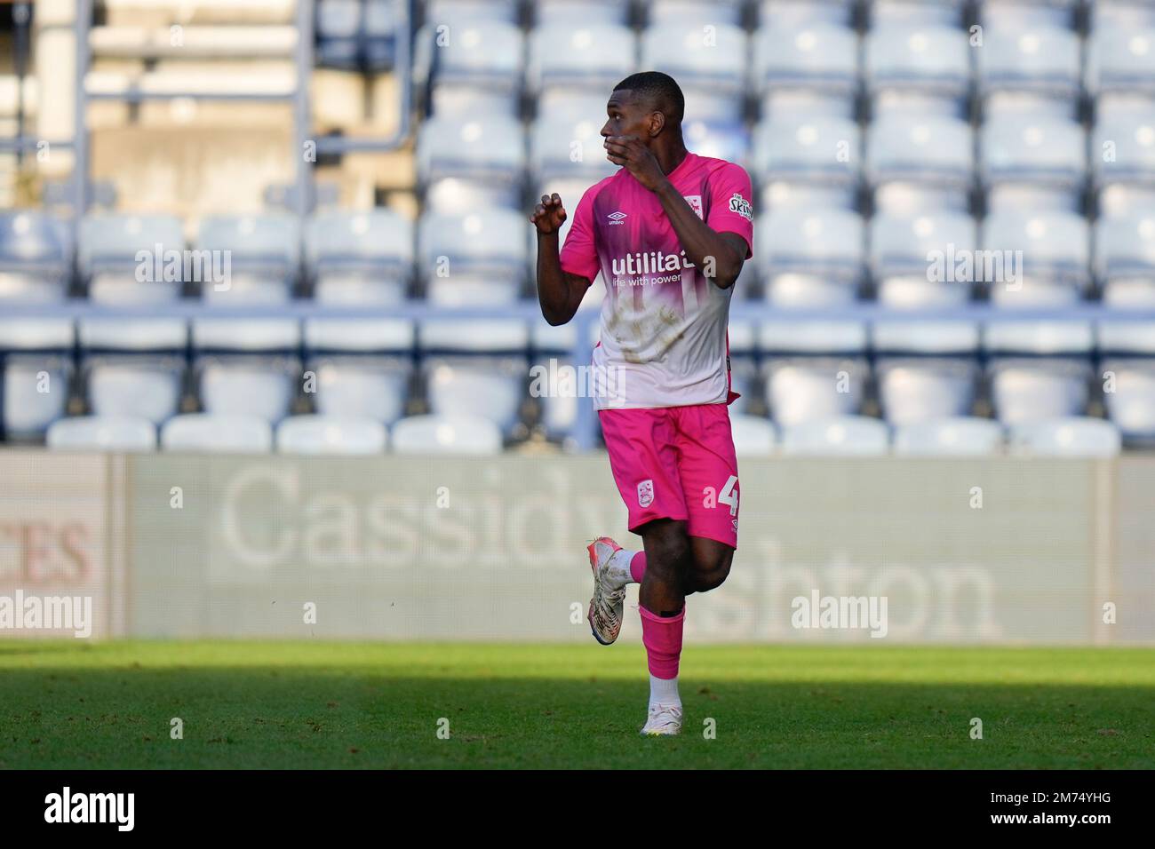 Loick Ayina #47 of Huddersfield Town salutes the fans after being ...