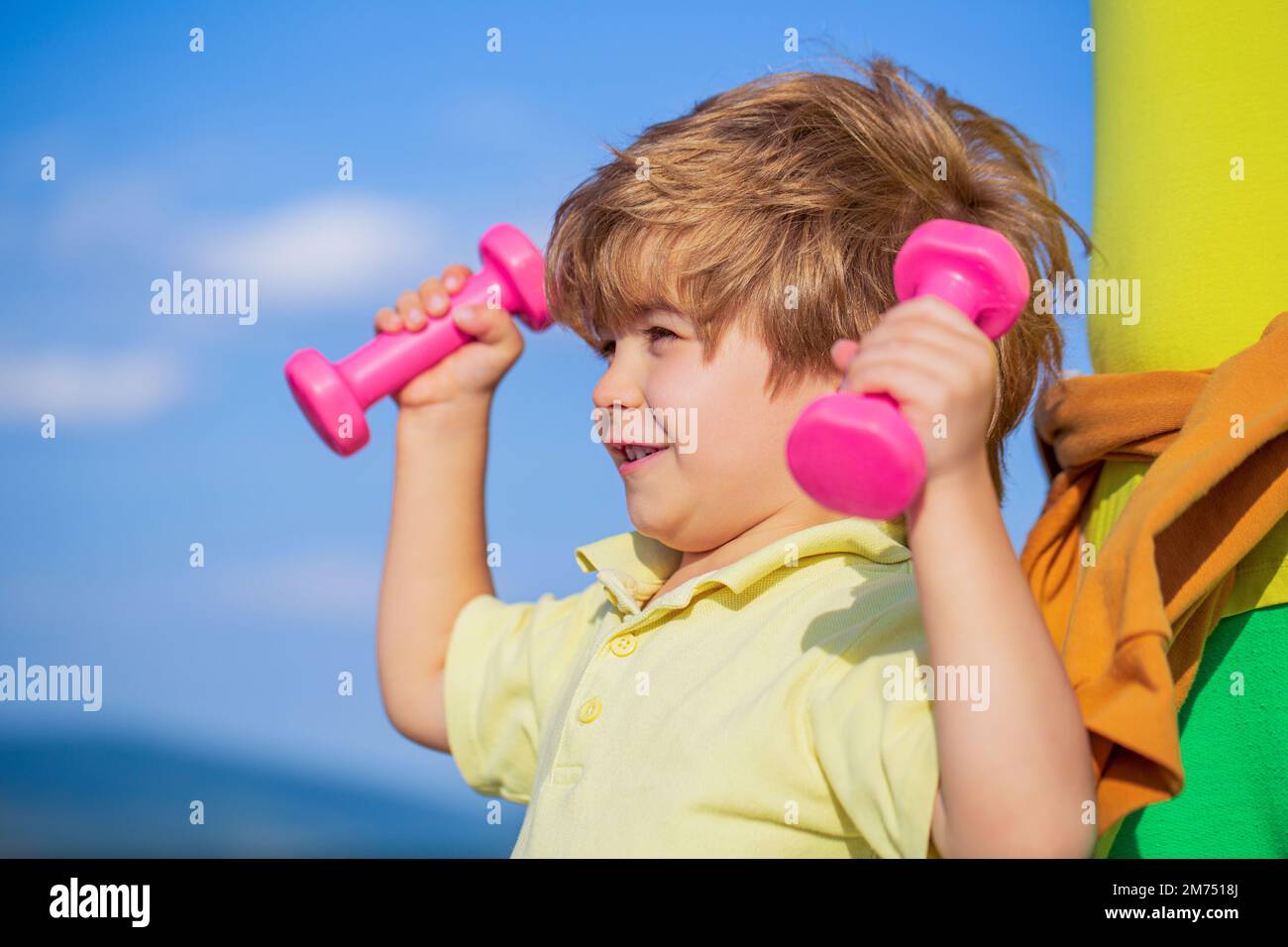 Sporty boy with dumbbells. Sport. Fitness, health and energy. Cheerful ...