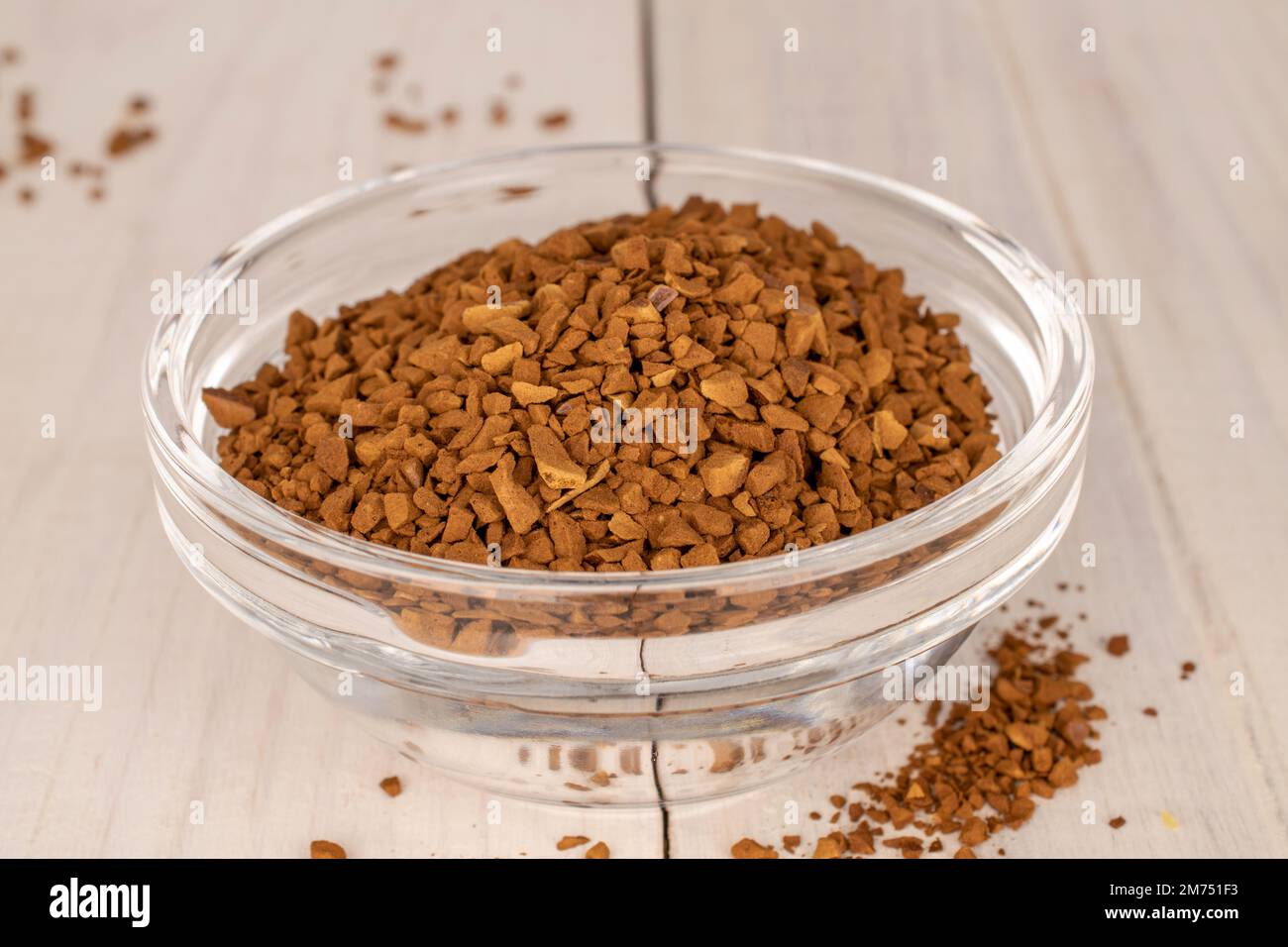 Fragrant instant coffee in a glass dish on a wooden table, macro Stock ...