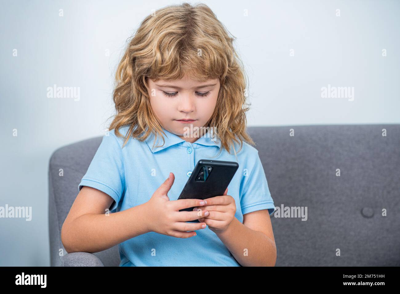 Boy communicates on Internet. Child gadget addiction, insomnia. Little ...