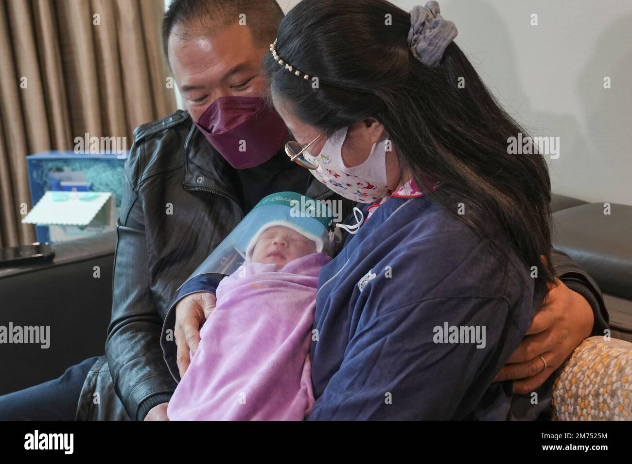 Roy Chan Ka-wing (L) and Fiona Chiu Sin-ting (C) gave birth to a baby son named Aden Chan Chun ...