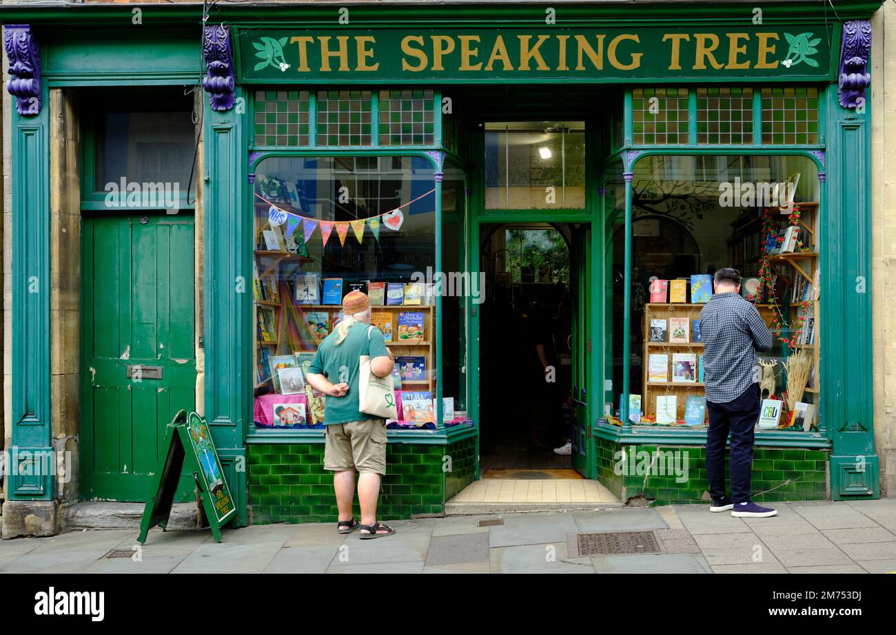 Visitors and window shoppers in front of The Speaking Tree shop ...