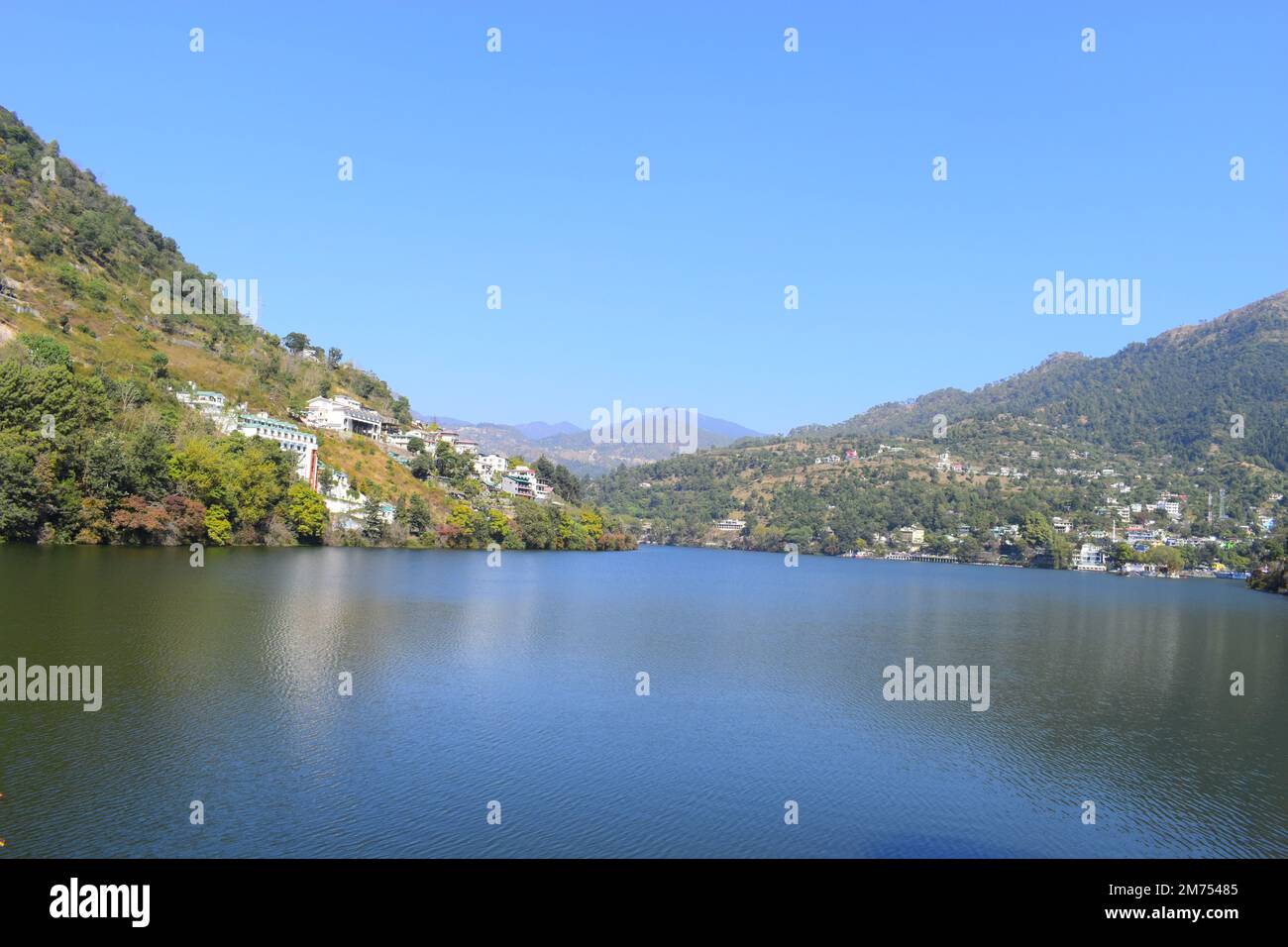 A beautiful landscape of Naini Lake in clean weather in Nainital, India ...