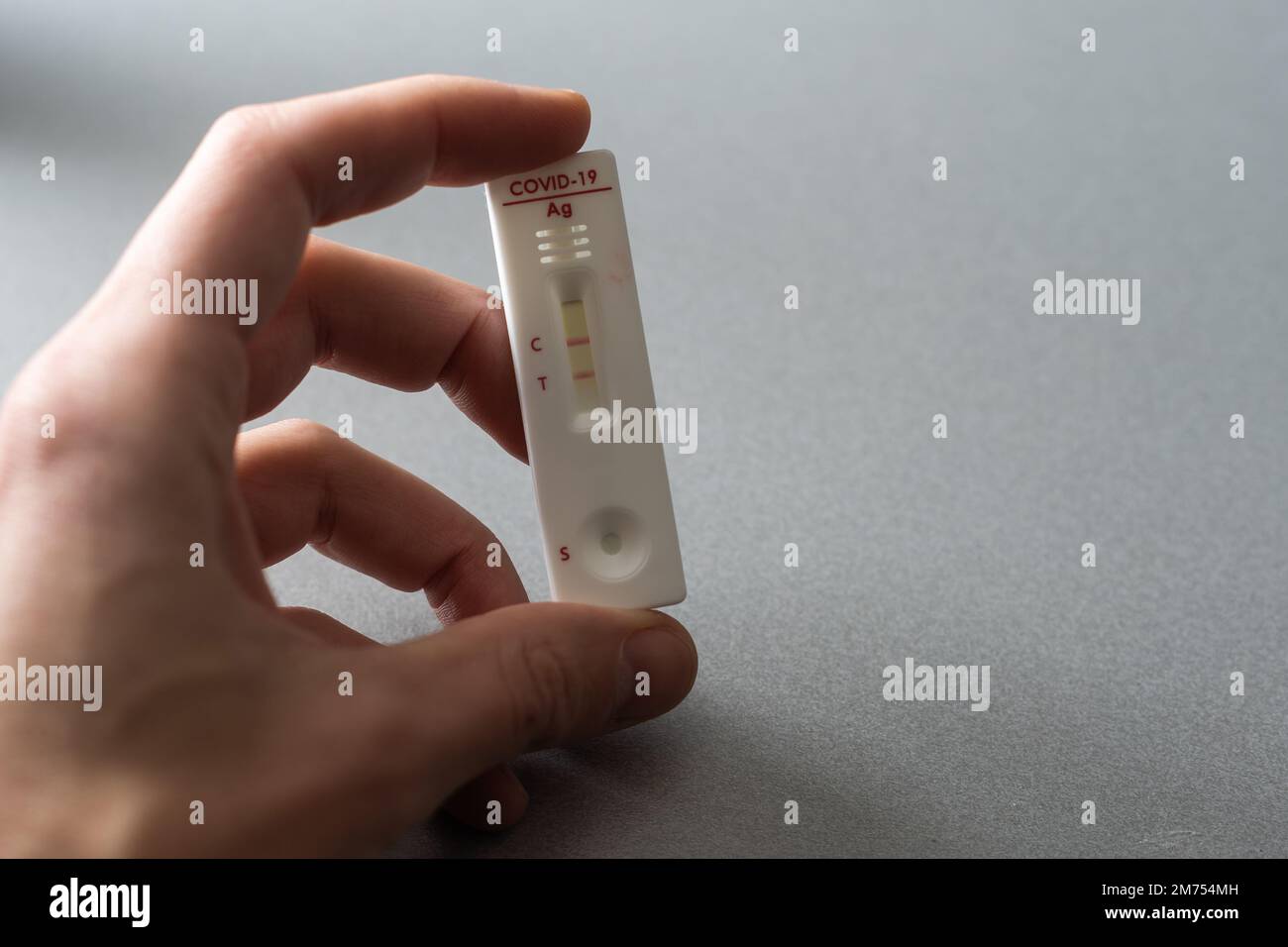 Hand holding rapid Coronavirus Covid-19 test device with negative test ...