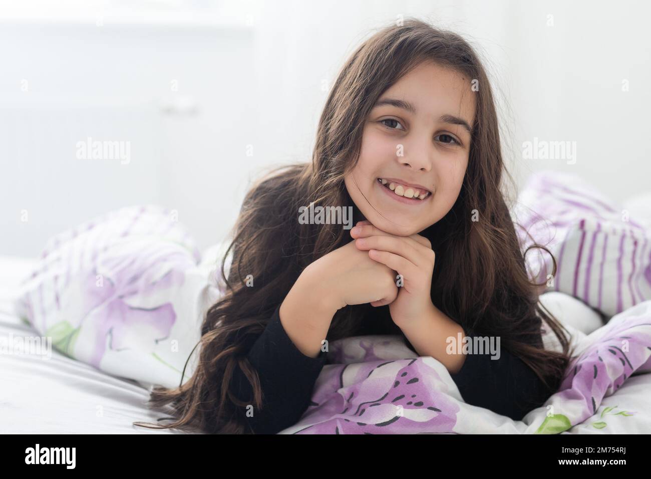 Teenager child girl daydreaming in bed, dreaming kids concept. Happy ...
