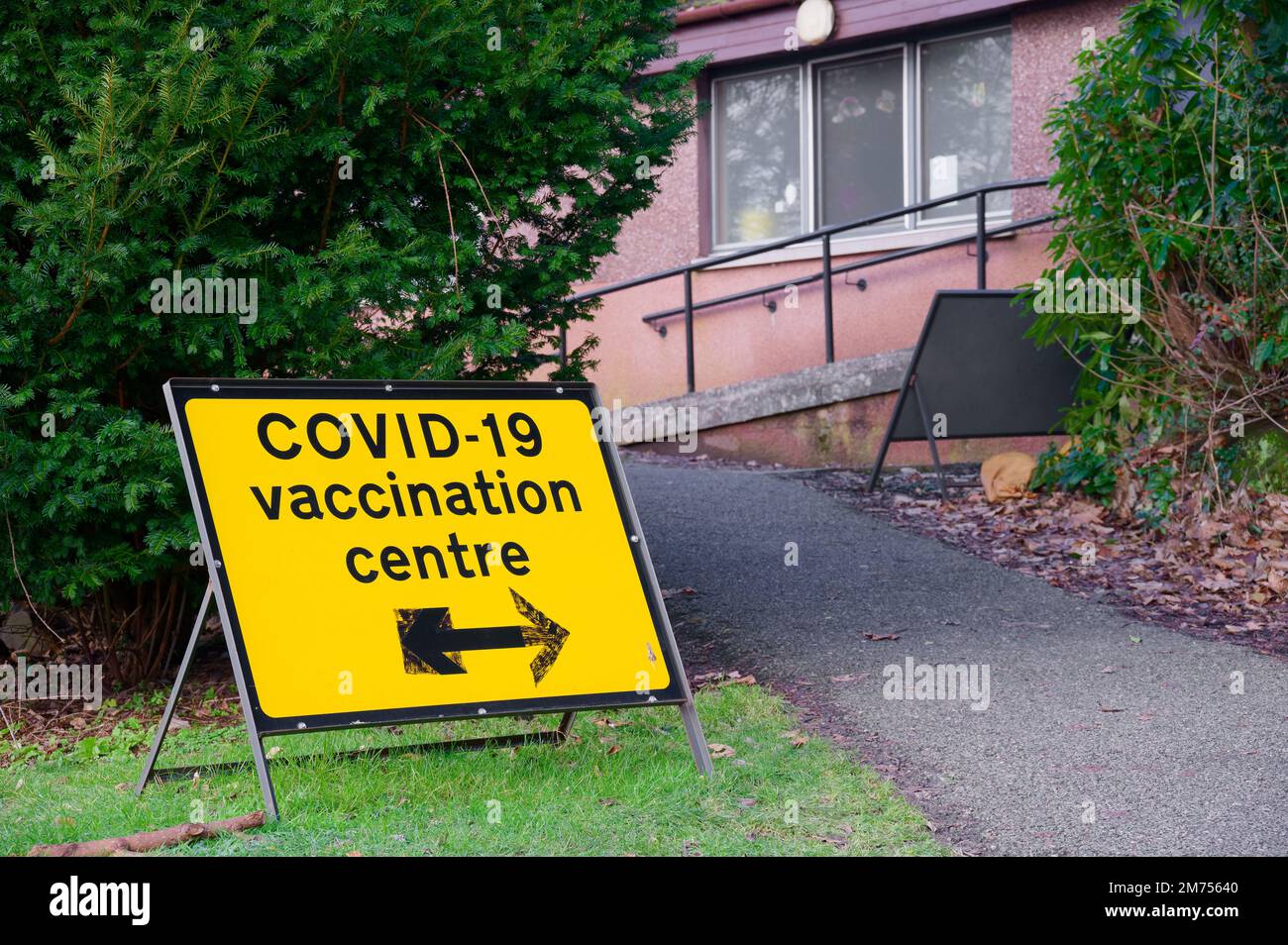 Vaccination medical centre for Covid-19 road sign Stock Photo - Alamy