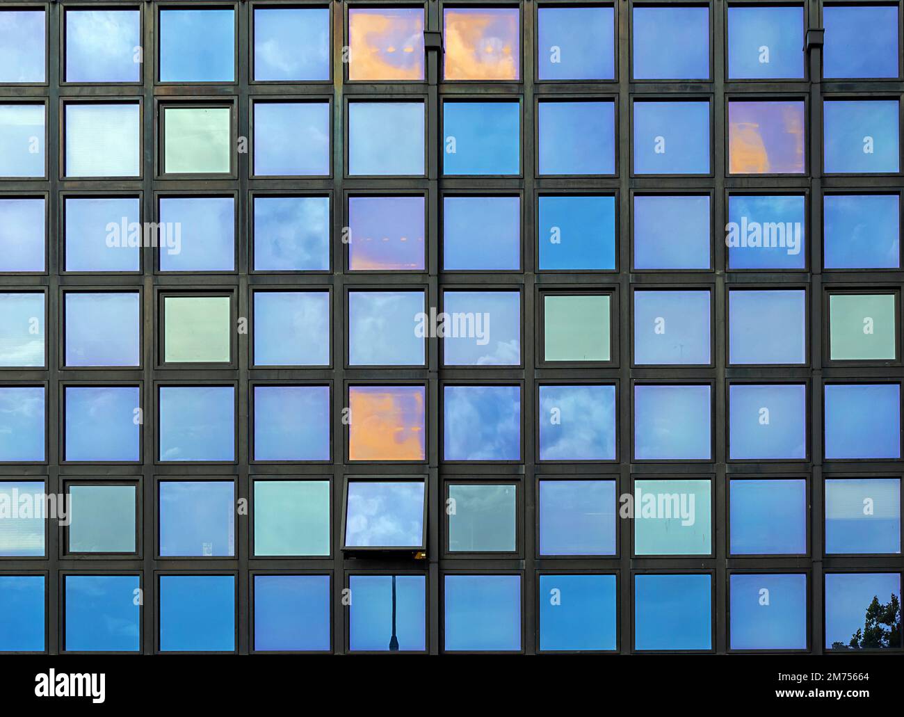 Blue glass building wall texture background with sun reflections Stock ...