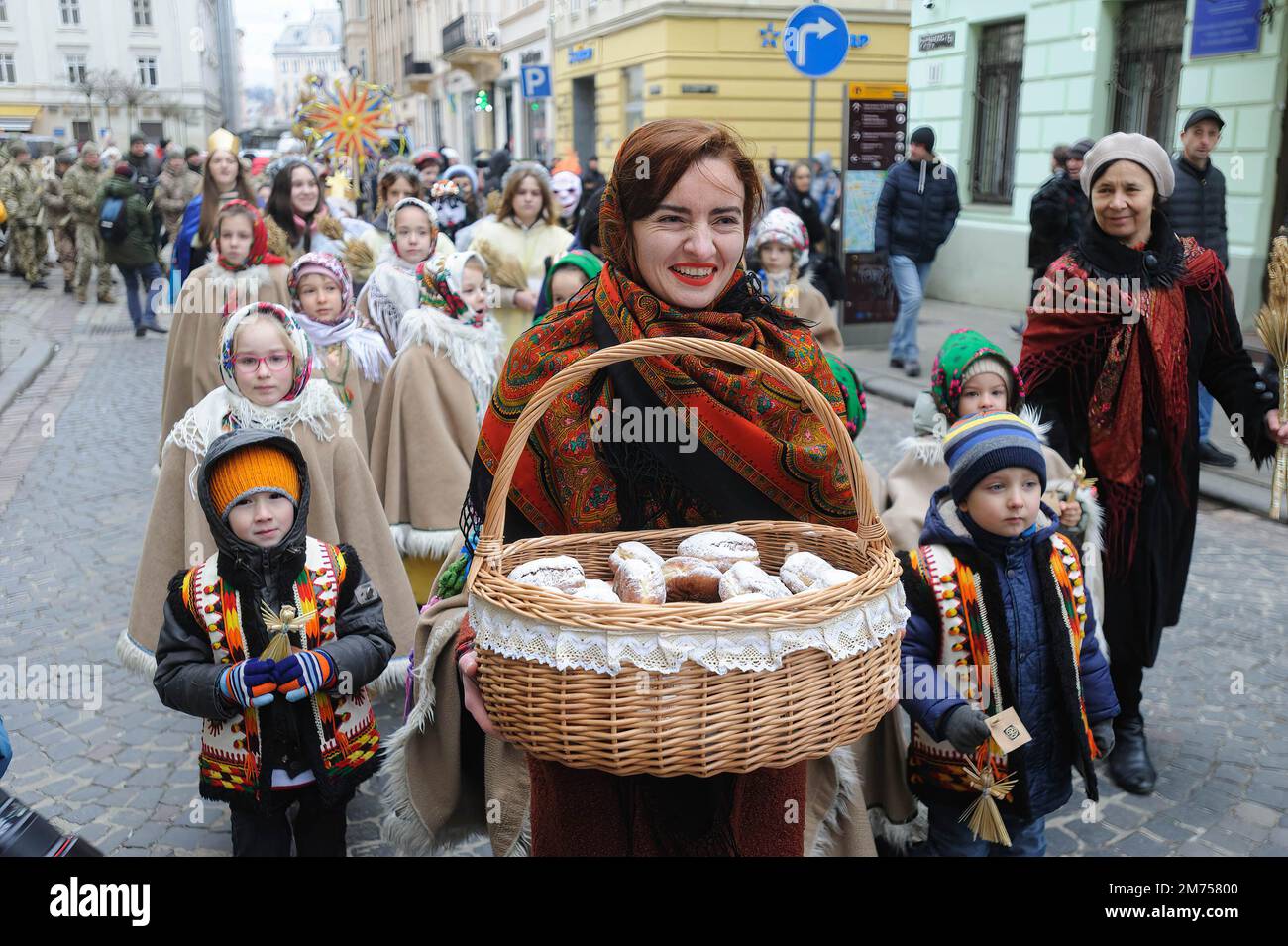 Lviv, Ukraine. 06th Jan, 2023. A woman carries a basket of buns while ...
