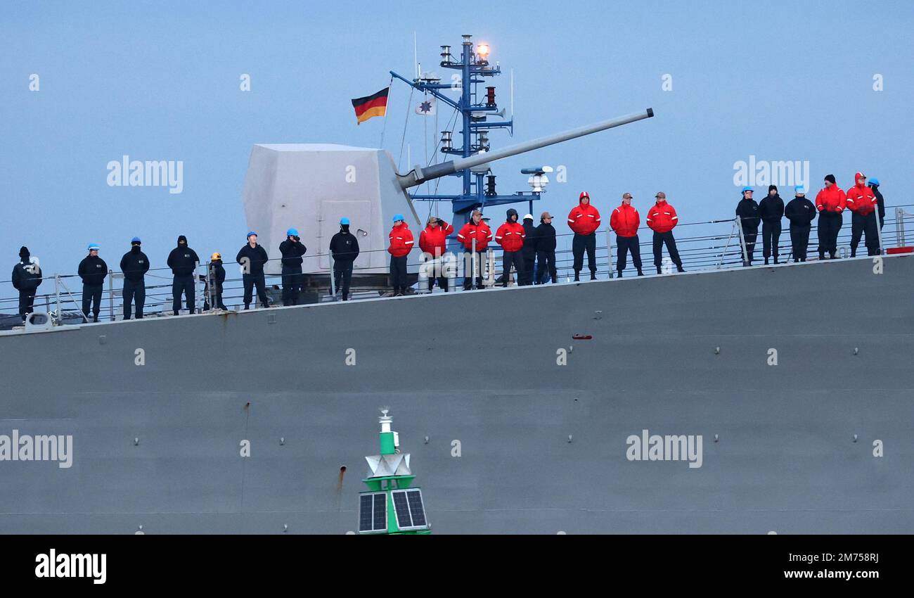 Rostock, Germany. 07th Jan, 2023. Crew members stand on the bow as the ...