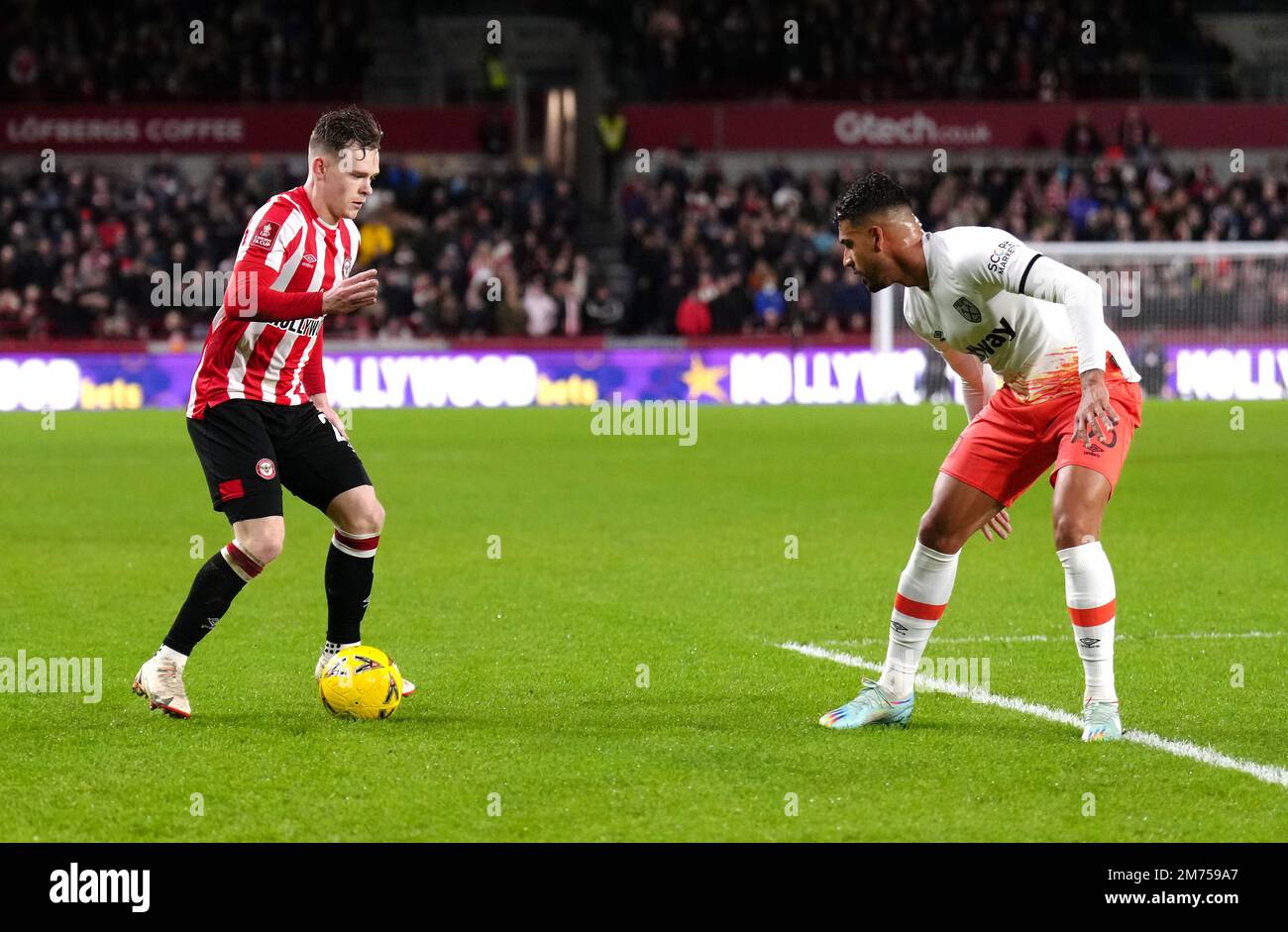 Brentford's Keane Lewis-Potter (left) and West Ham United's Emerson ...