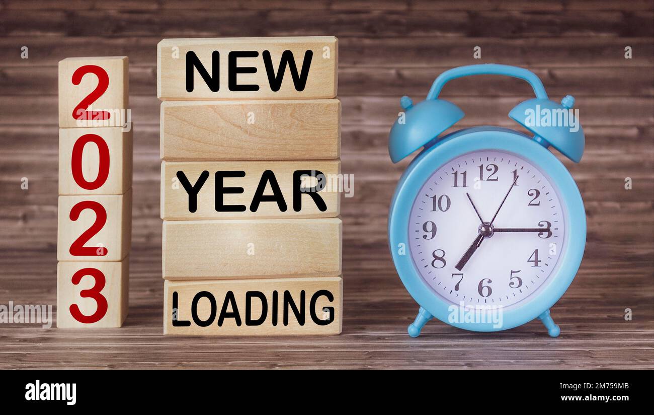 2023 New Year Loading text on wooden blocks and wooden background with ... 2023 New Year Loading text on wooden blocks and wooden background with ...