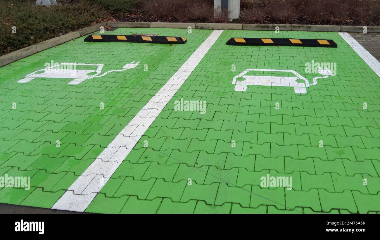 A parking lot marked with green paint for electric cars Stock Photo - Alamy
