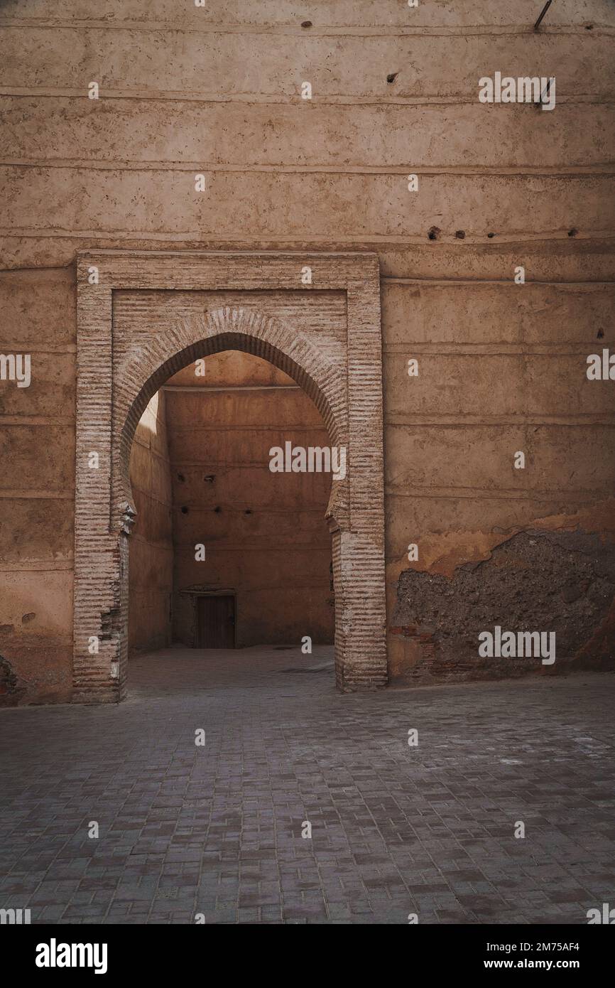 Archway in old ancient walls of city of Marrakech in Morocco.Portrait ...