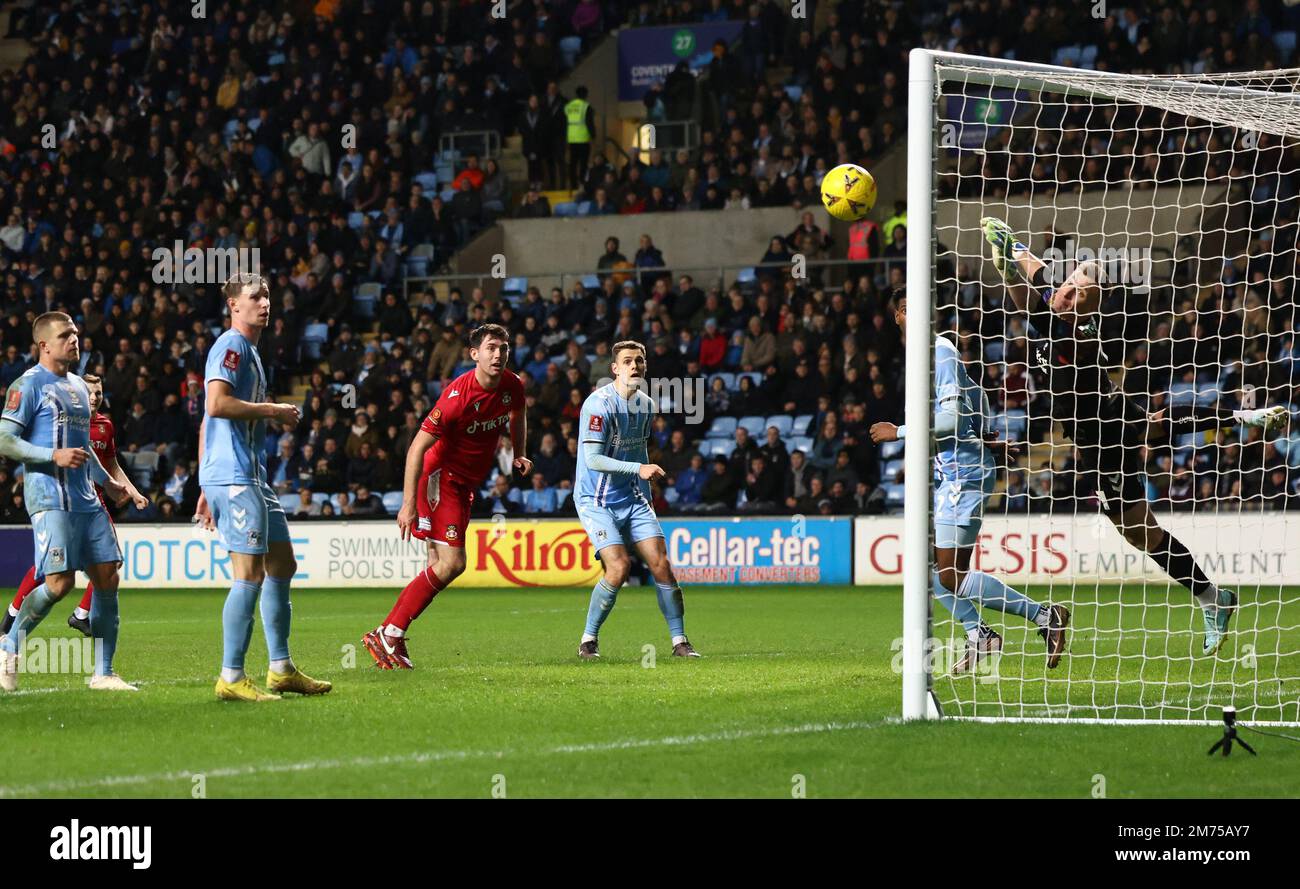 Coventry, UK. 7th Jan, 2023. Tom O'Connor of Wrexham scores their third ...