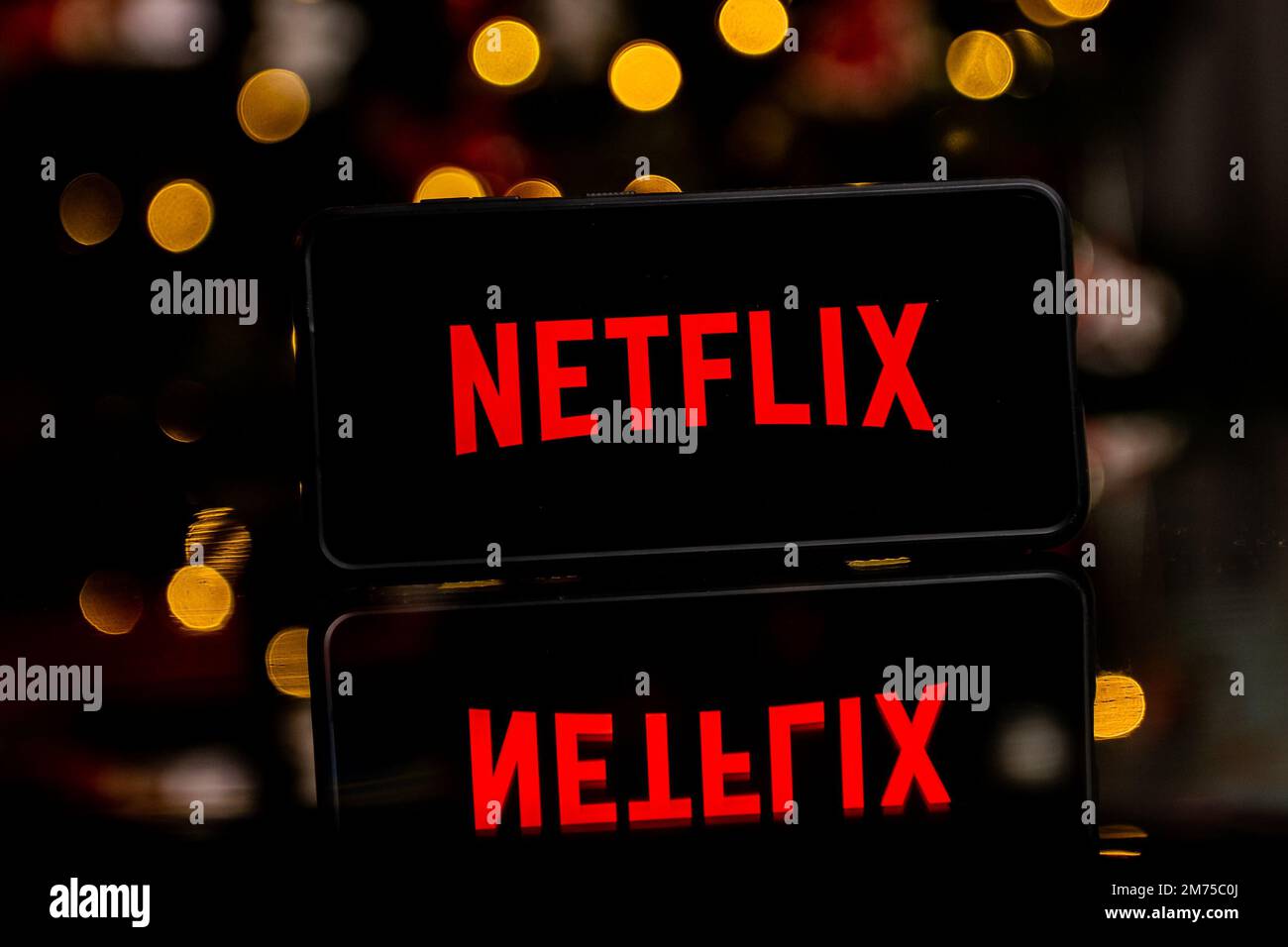 In this photo illustration a Netflix logo seen displayed on a ...