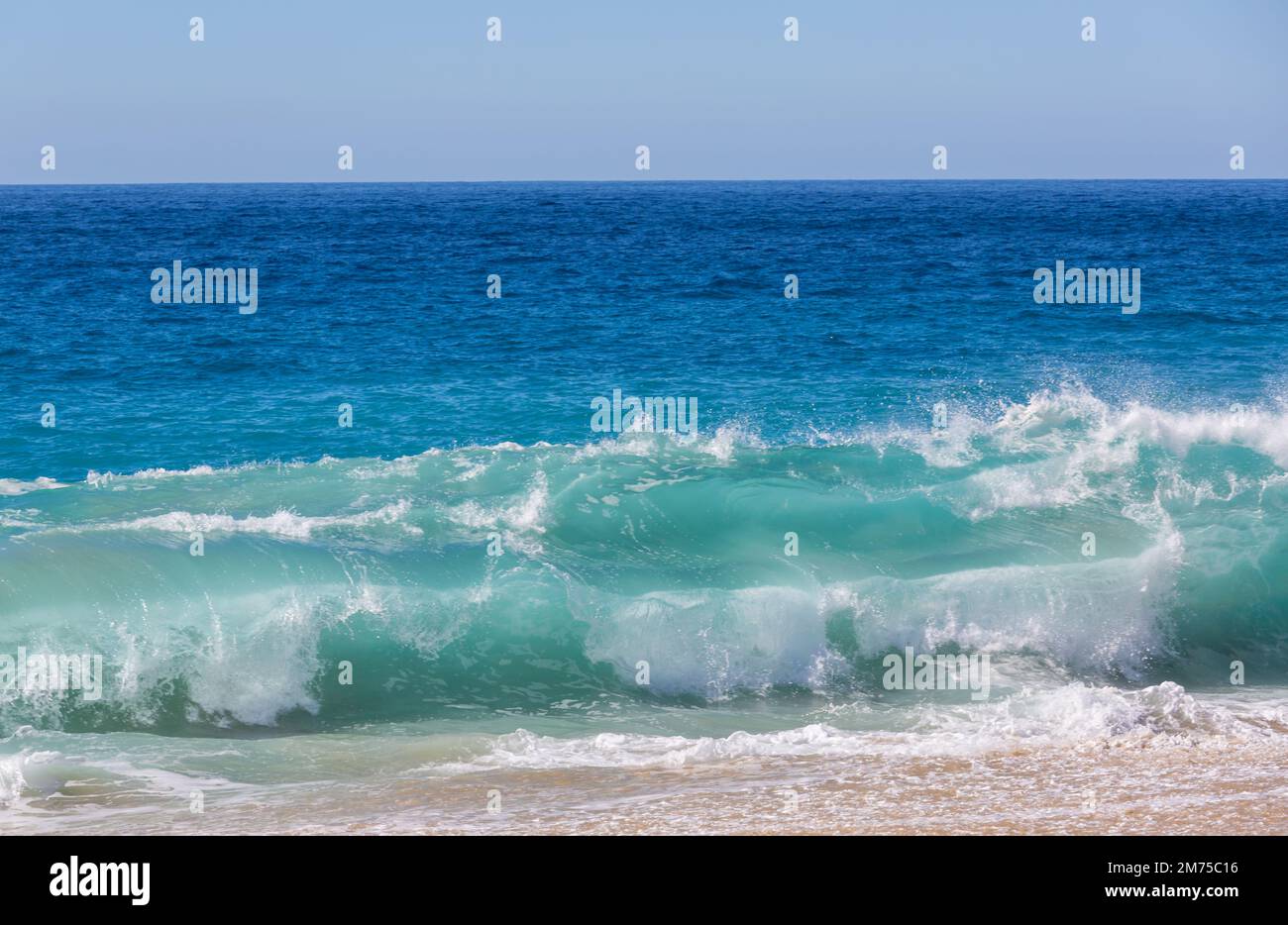Blue wave on the beach. Dramatic natural background Stock Photo - Alamy