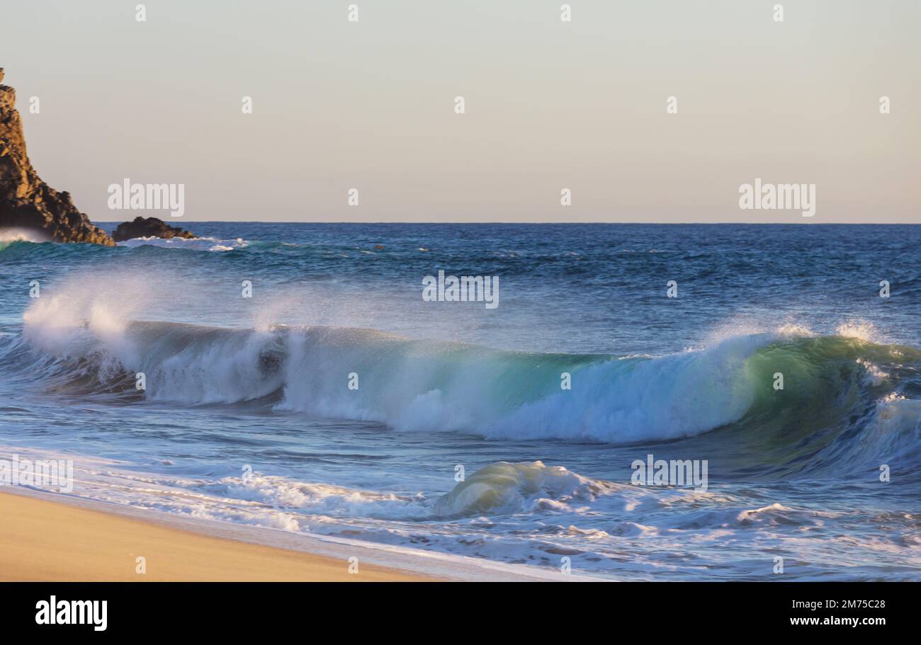 Blue wave on the beach. Dramatic natural background Stock Photo - Alamy
