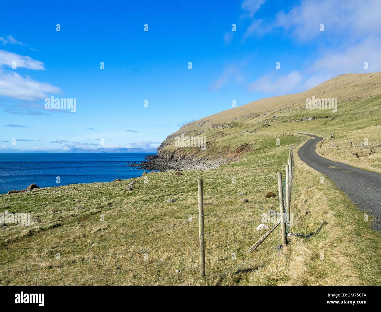 Road along Sandoy island coastline Stock Photo - Alamy