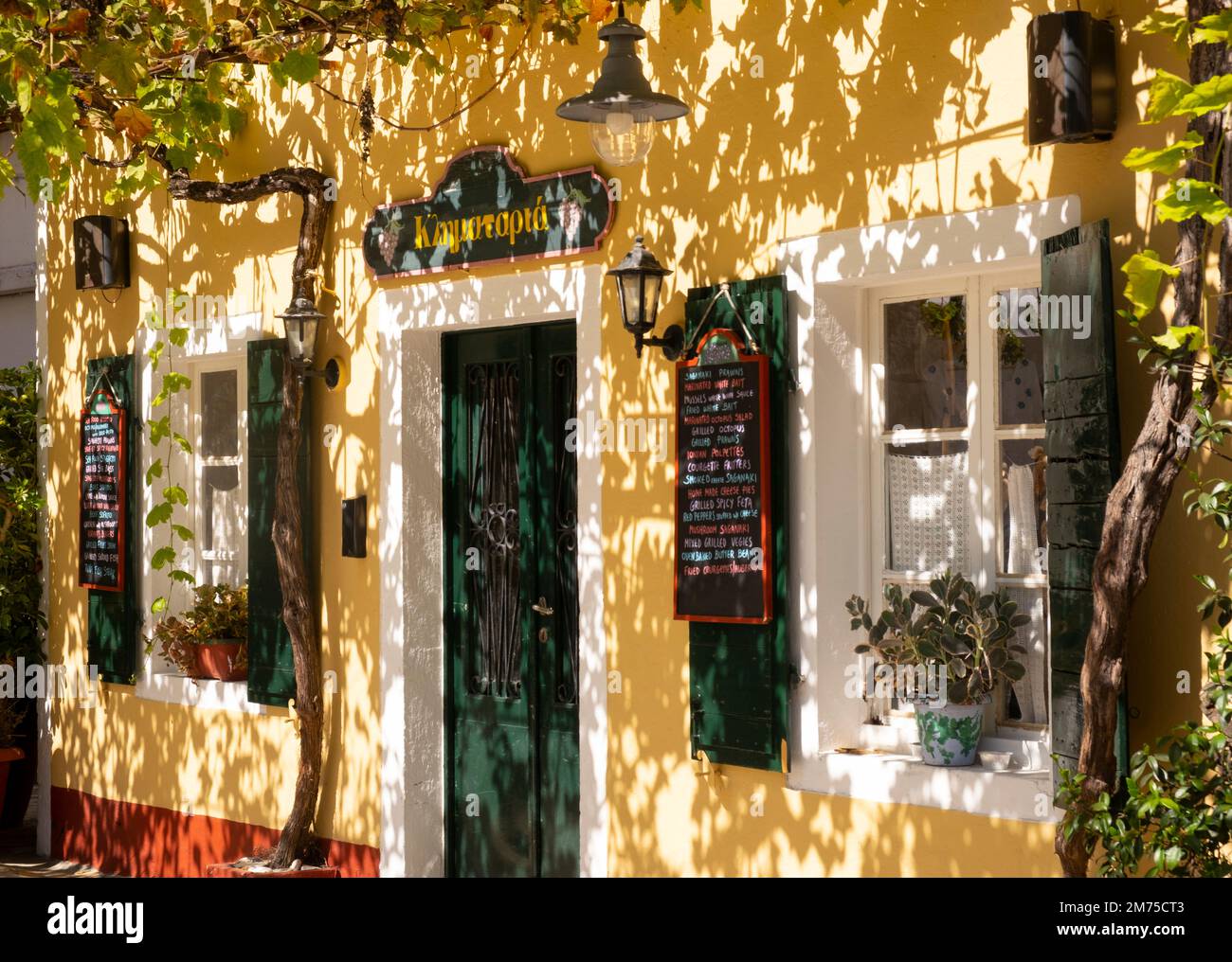 Colourful menu signs outside a traditonal taverna in Lakka on Paxos ...