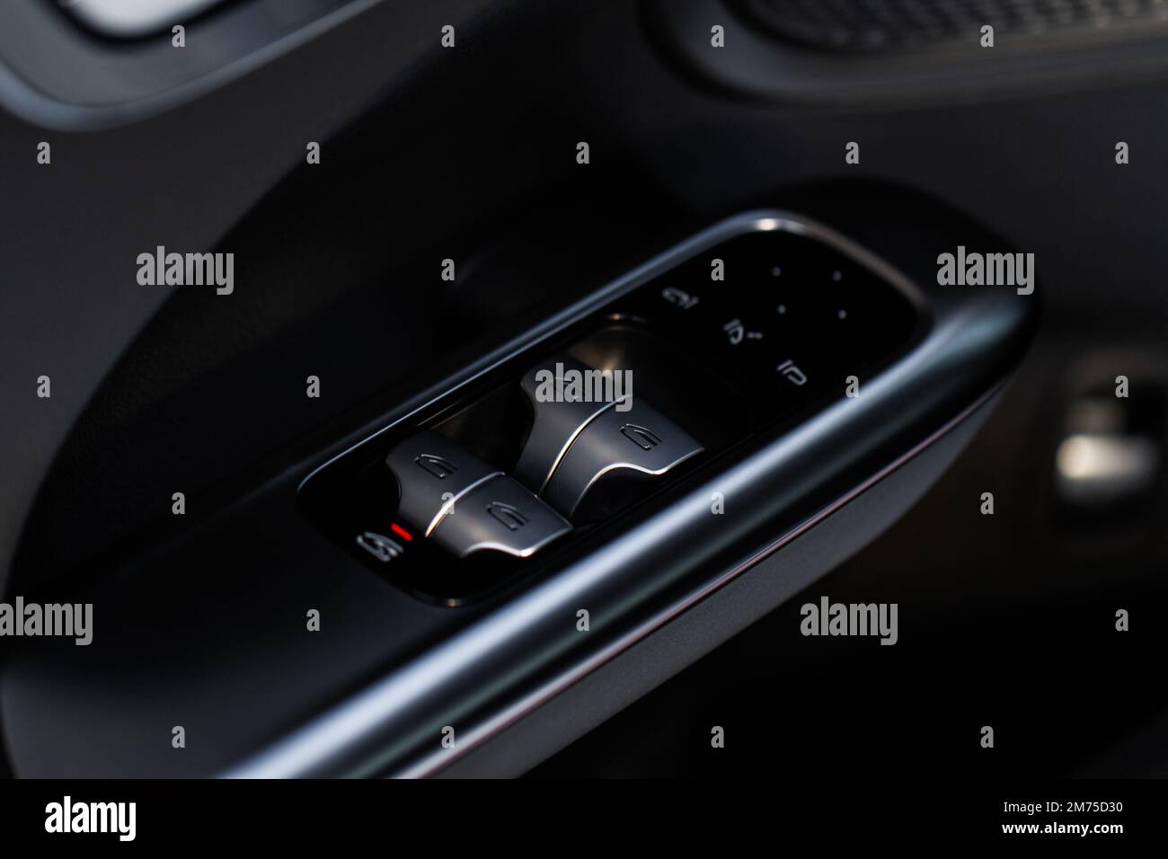 Close up view of button controlling window in modern car interior ...