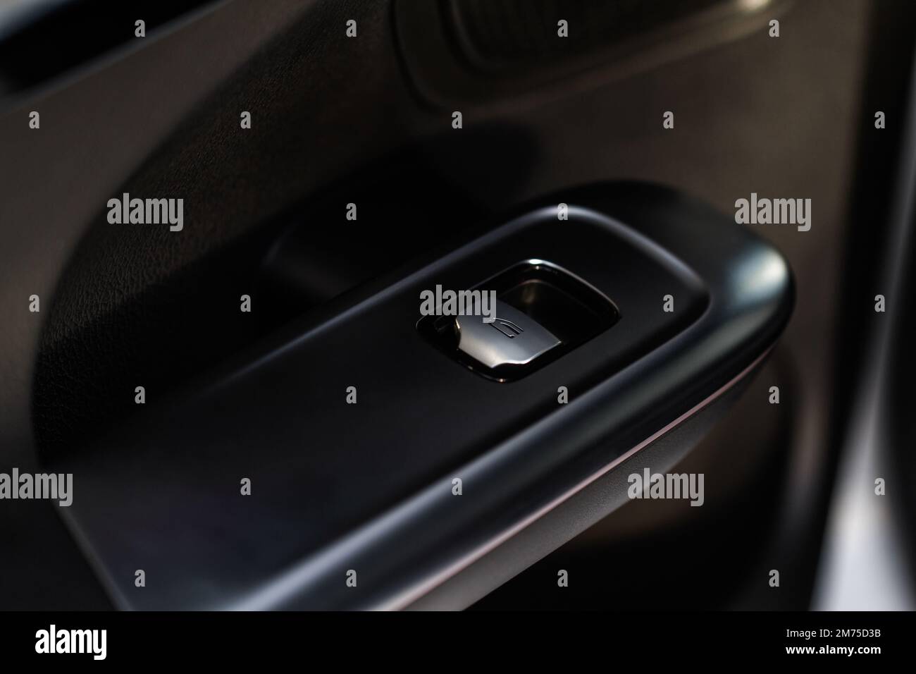 Close up view of button controlling window in modern car interior ...