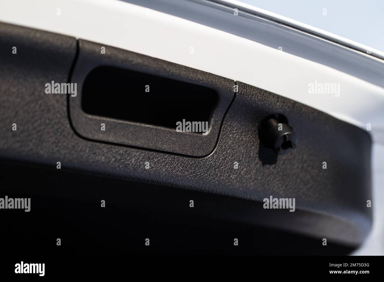 Car trunk door handle Stock Photo - Alamy