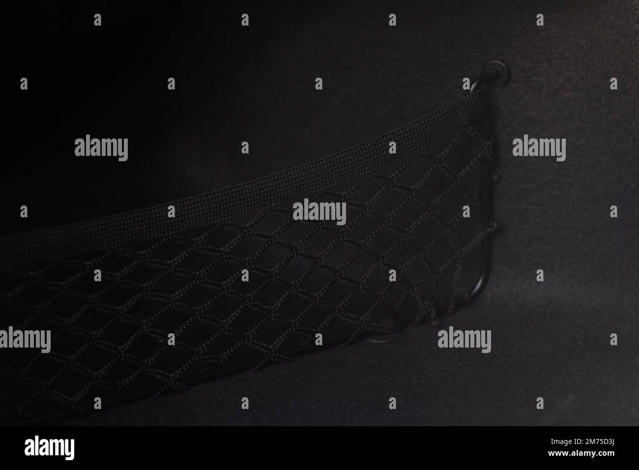 The luggage net inside modern car trunk Stock Photo - Alamy