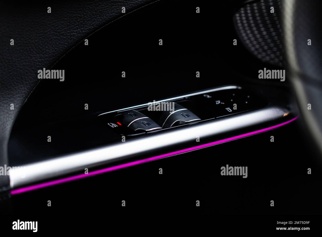 Close up view of button controlling window in modern car interior ...