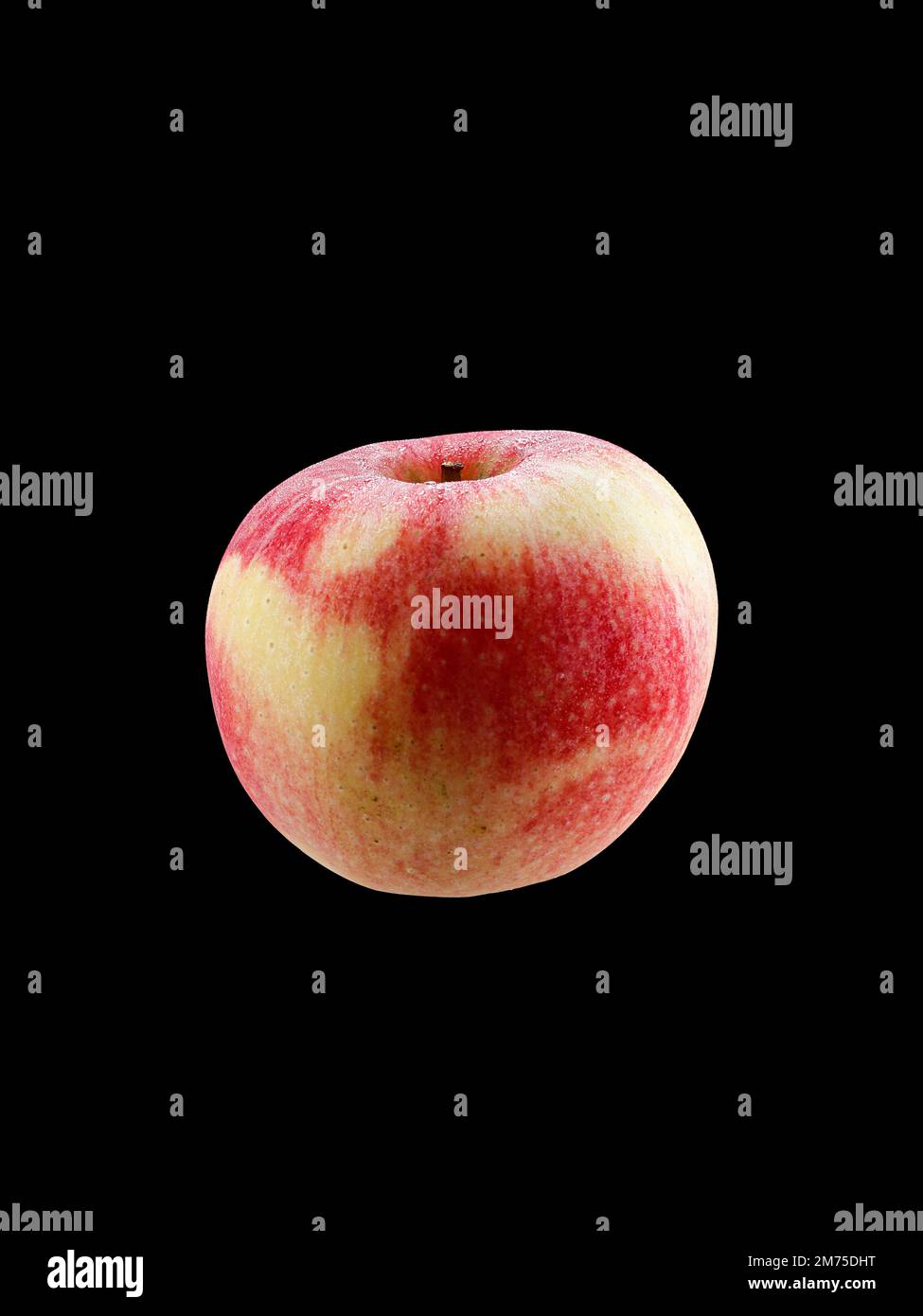 A vertical shot of a red apple isolated on a black background Stock ...