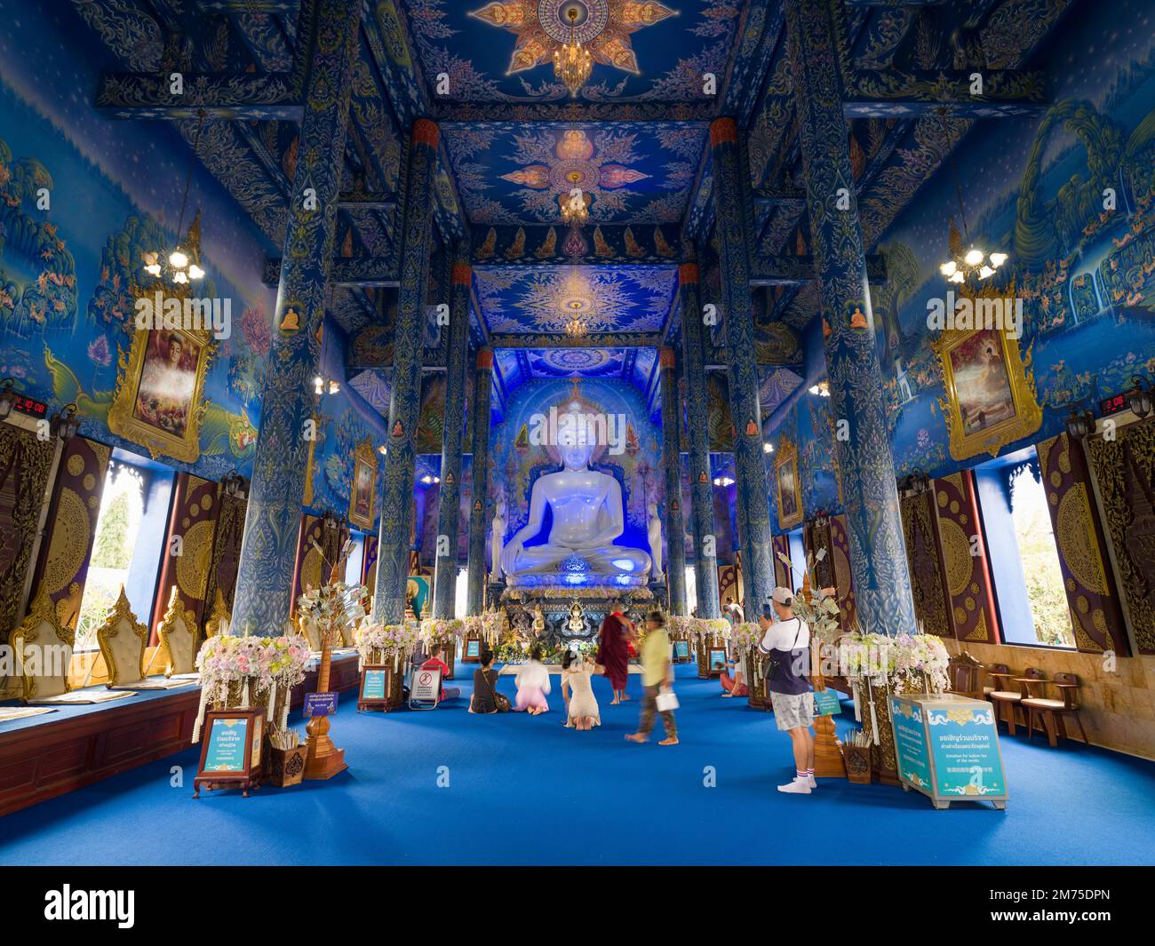 Chiang Rai, Thailand, November 18, 2022. People praying inside Wat Rong ...