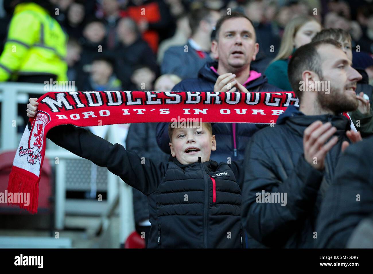 Football supporter holds up scarf hi-res stock photography and images ...