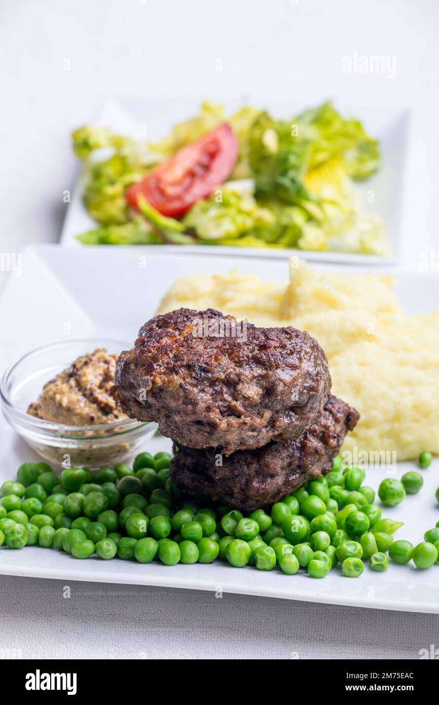 Bavarian meat loafs with peas hi-res stock photography and images - Alamy